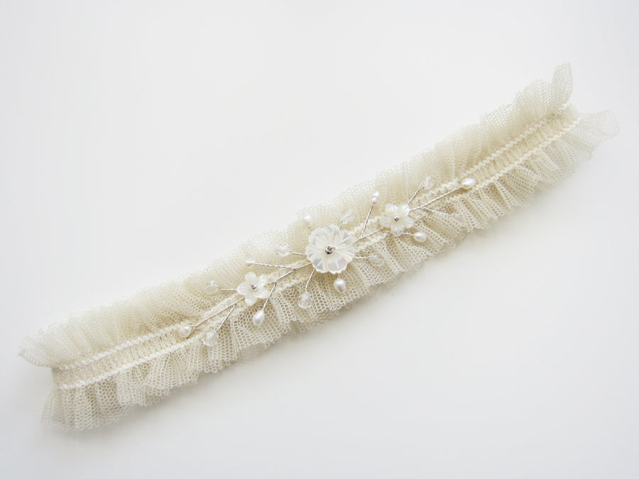 Elegant ivory cream garters with crystal or floral jewel embellishment ...
